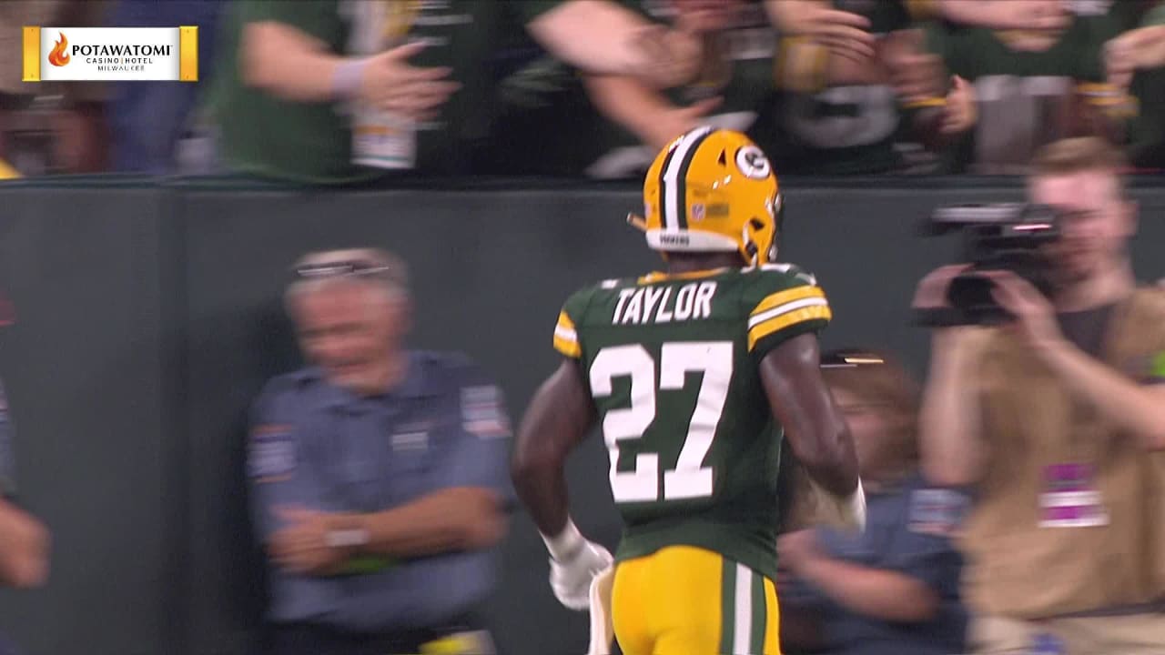 Green Bay Packers running back Patrick Taylor hits the Lambeau Leap ...