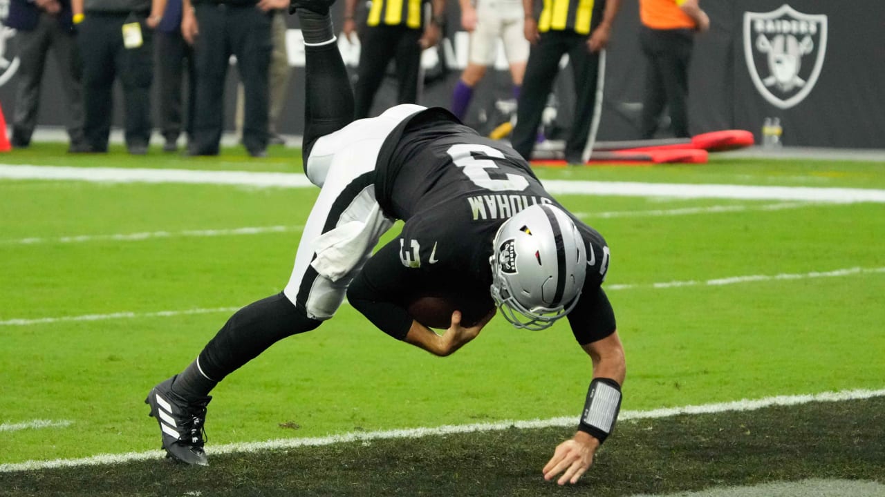 Las Vegas Raiders quarterback Jarrett Stidham steps up the pocket and runs it in for a 4-yard ...
