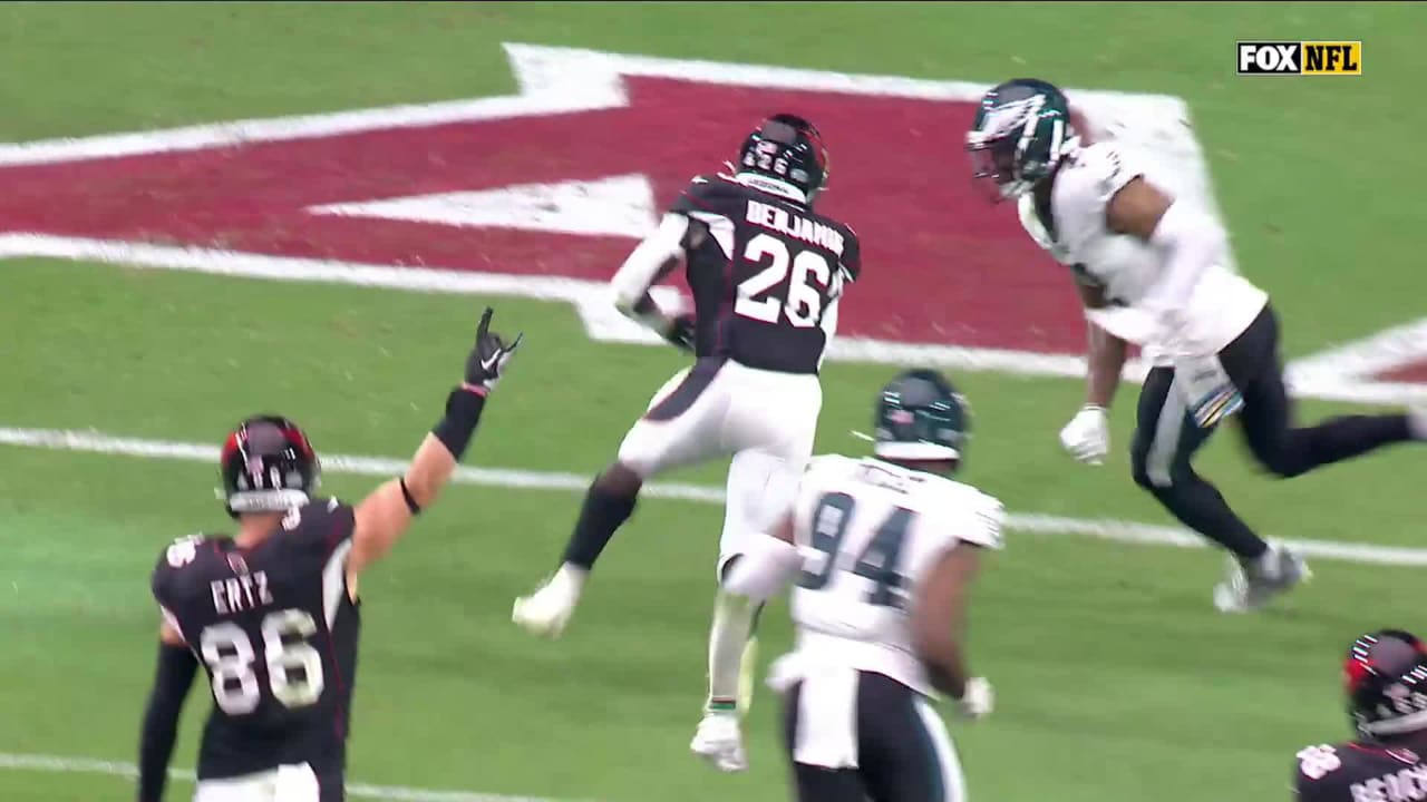 Arizona Cardinals running back Eno Benjamin bursts through the line for ...