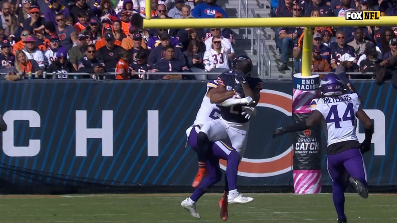 Chicago Bears wide receiver DJ Moore absorbs strong hit from Minnesota Vikings safety Camryn ...