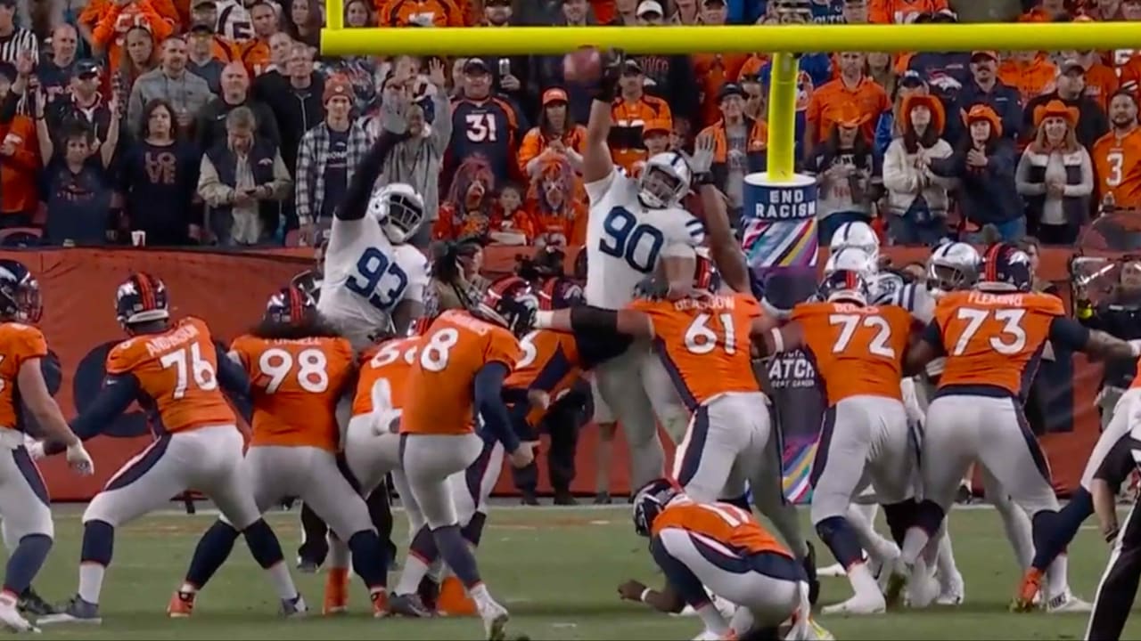 Indianapolis Colts defensive tackle Grover Stewart paws away Denver ...