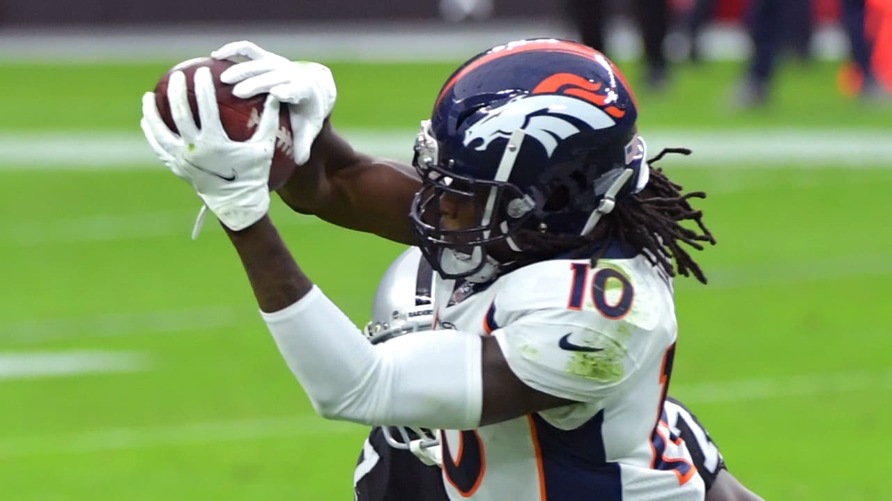 Denver Broncos quarterback Drew Lock dots wide receiver Jerry Jeudy in ...