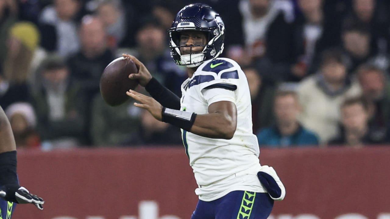 Seattle Seahawks quarterback Geno Smith steps up in the pocket to ...