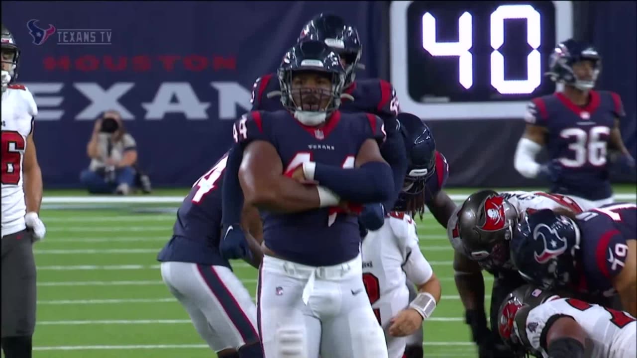 Houston Texans defensive end DeMarcus Walker paws the ball from Tampa ...