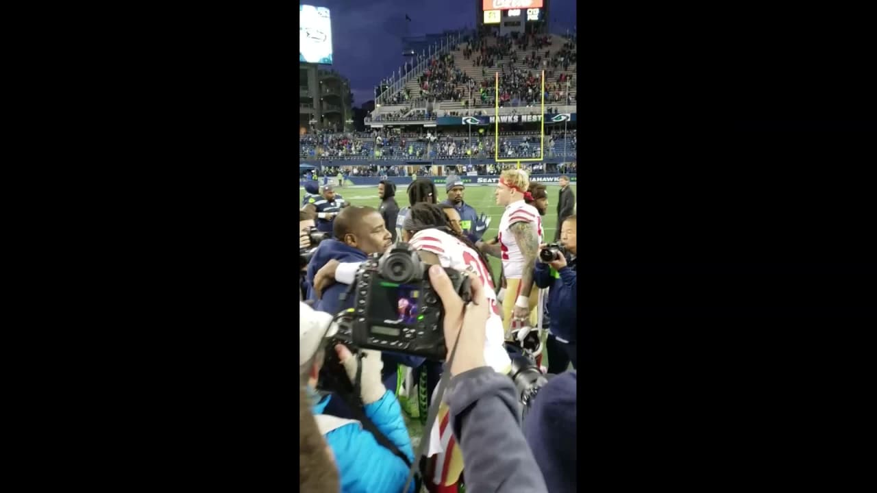 Richard Sherman hugs his old Seahawks teammates