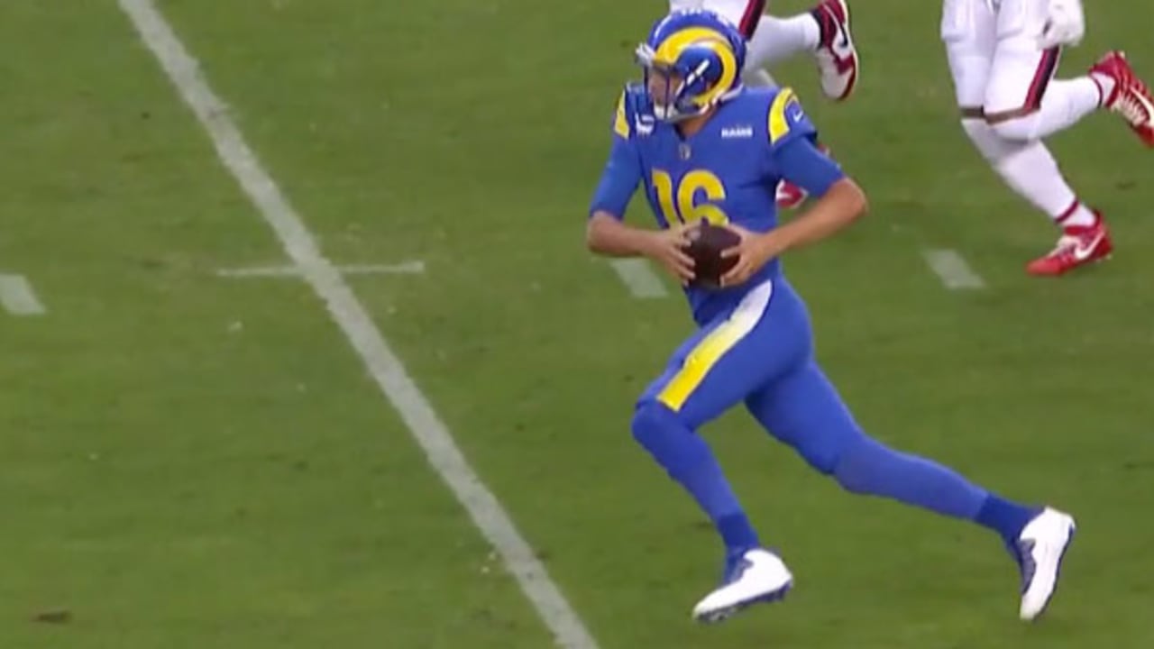 Los Angeles Rams quarterback Jared Goff runs up the middle to pick up ...