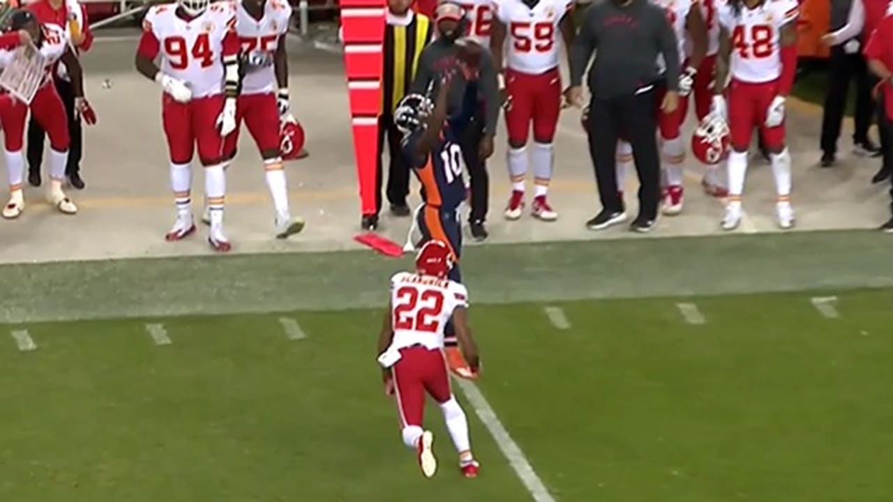 Sanders reaches high for sideline throw for first down