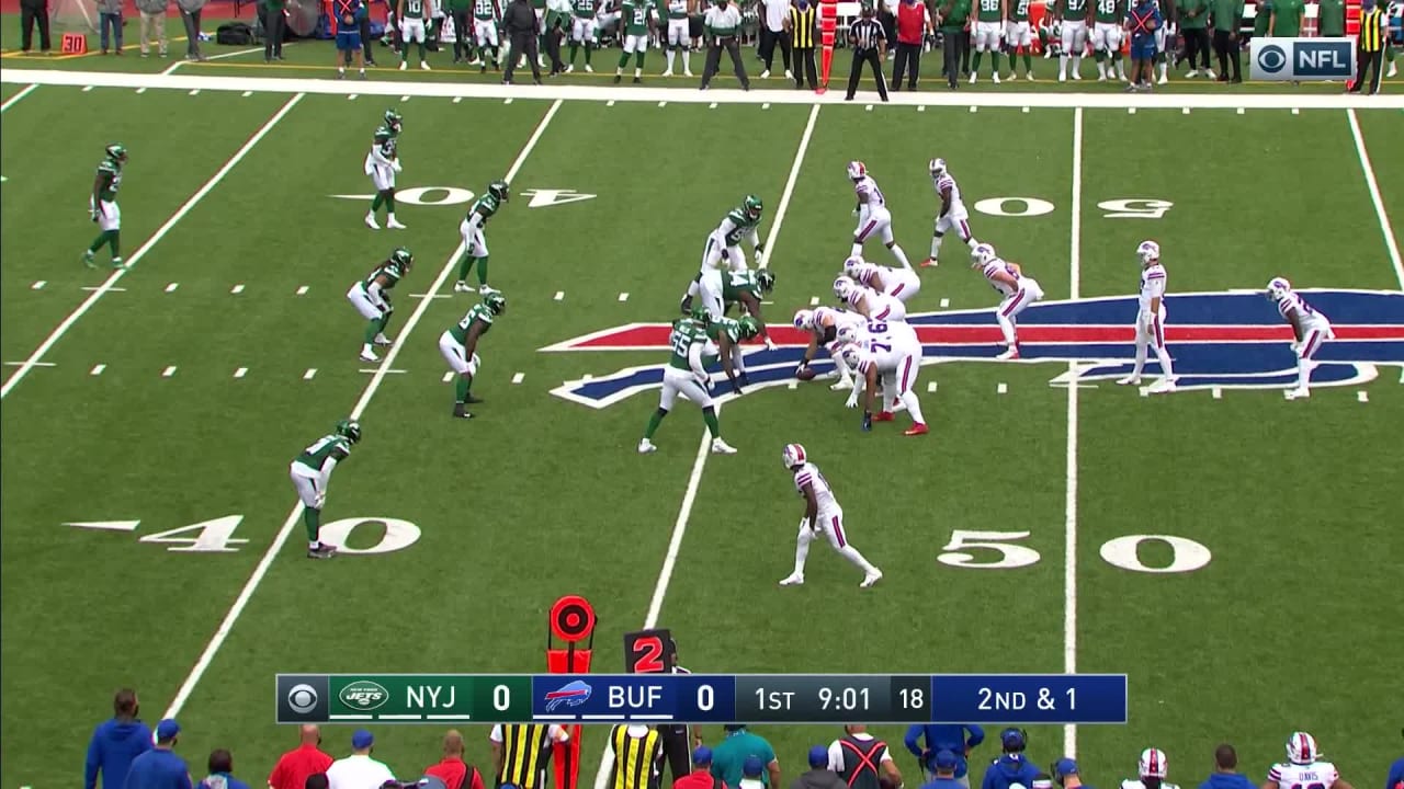 Buffalo Bills quarterback Josh Allen eludes a sack and turns it into a ...
