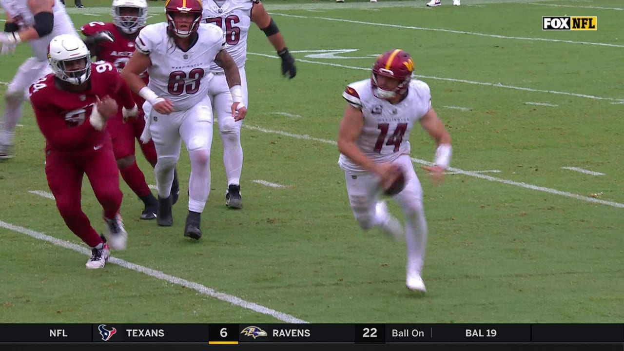 Washington Commanders quarterback Sam Howell scrambles into the endzone ...