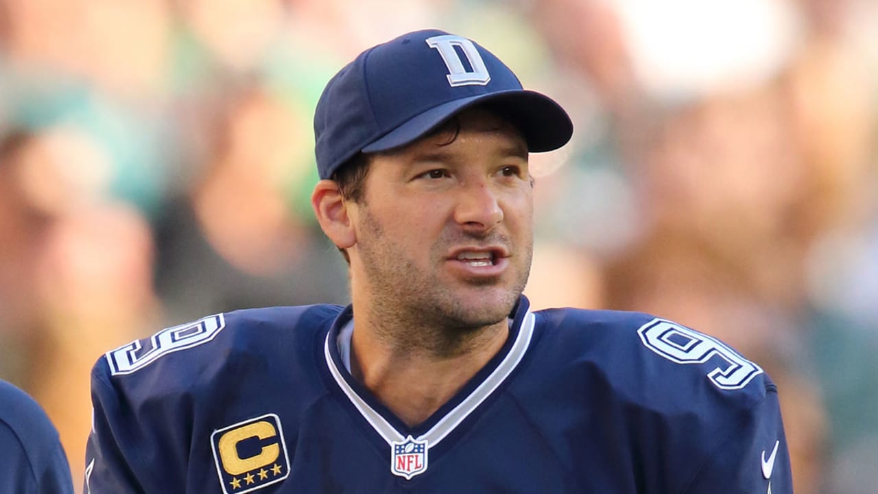 Tony Romo breaks bone in back, out until mid-season