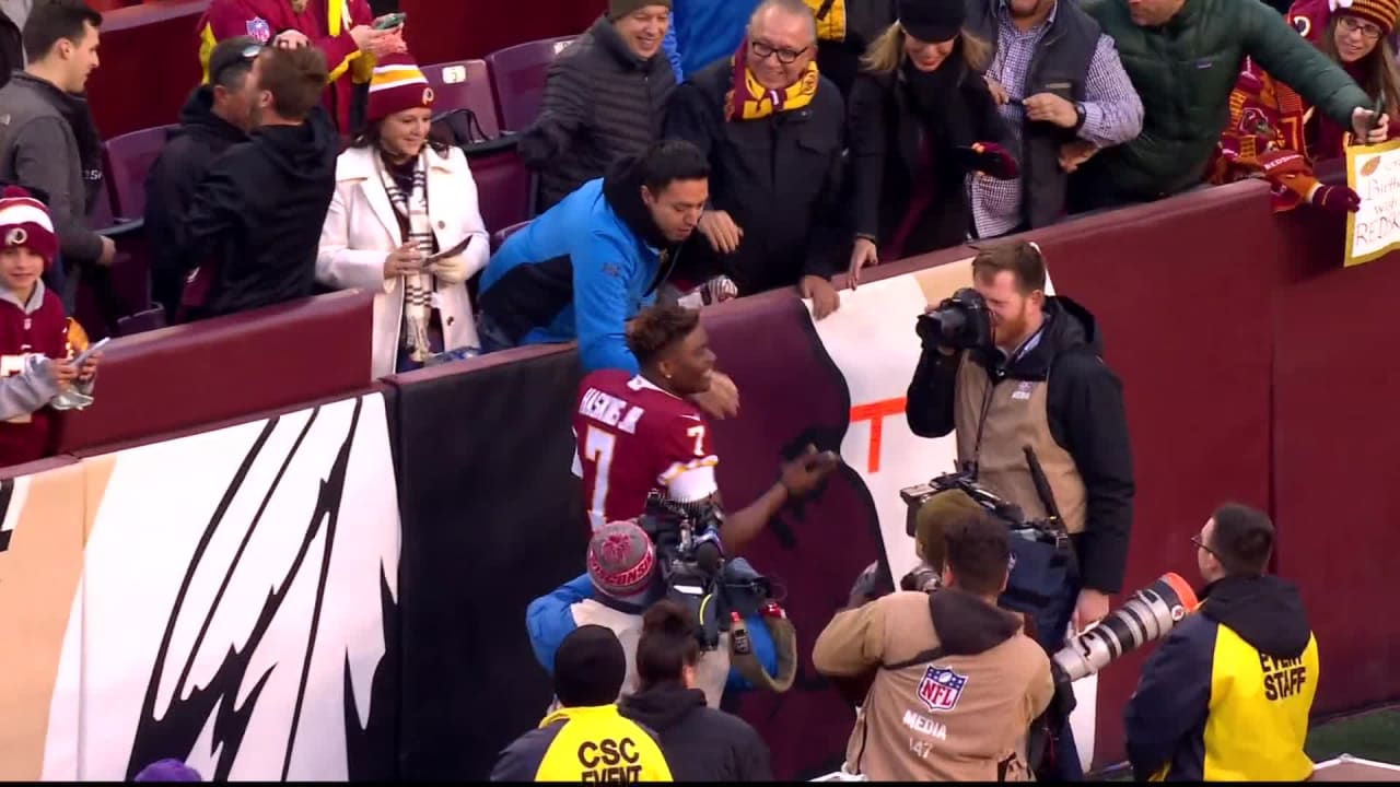 Haskins celebrates first win as starter by taking selfie with fans