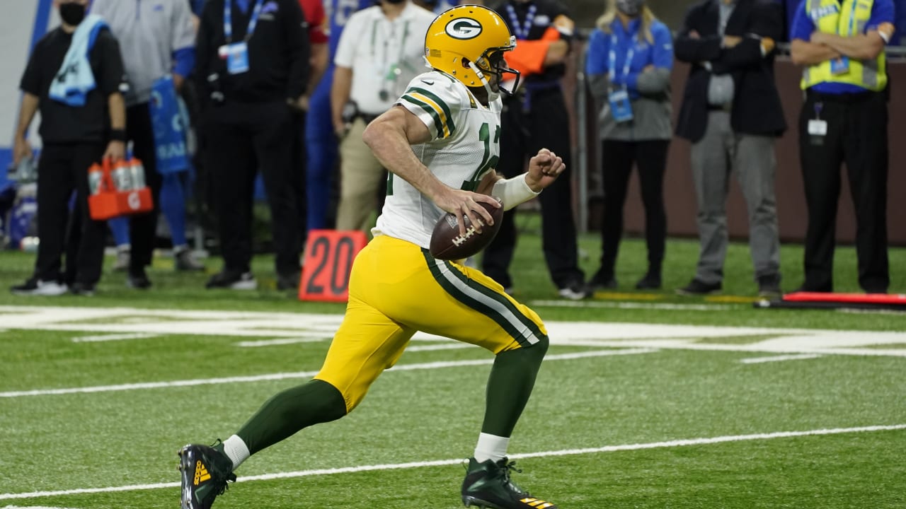 Green Bay Packers quarterback Aaron Rodgers scrambles 6 yards for his ...