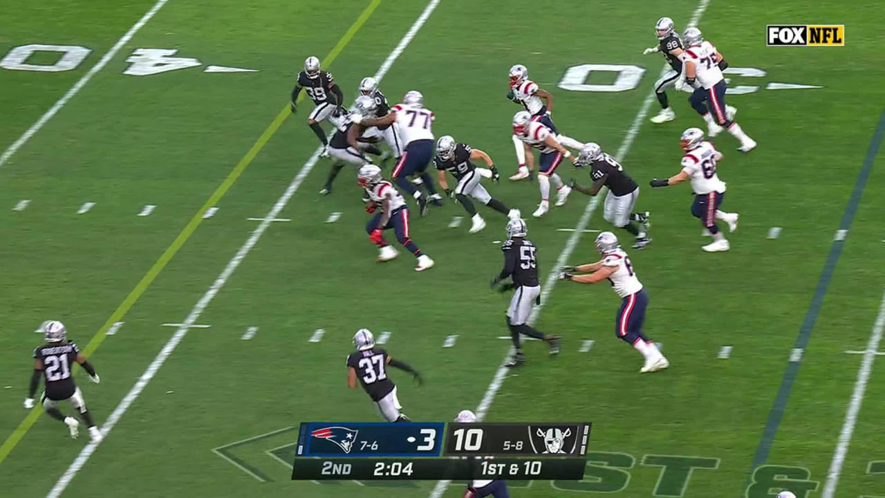 New England Patriots running back Rhamondre Stevenson weaves through ...