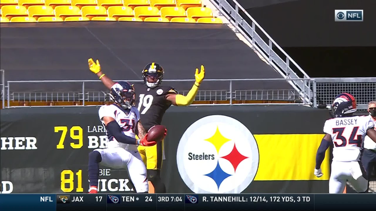 Denver Broncos safety Justin Simmons one-hands an interception from ...