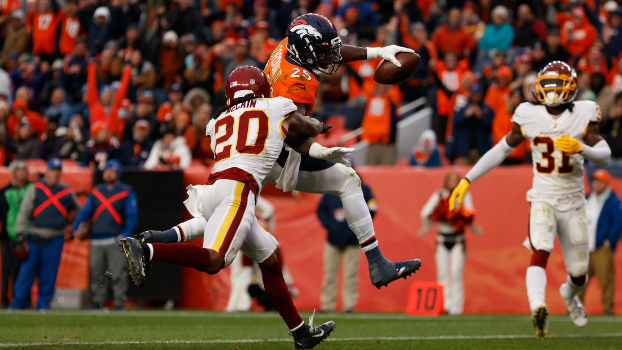 Denver Broncos running back Melvin Gordon rushes up the middle for a ...