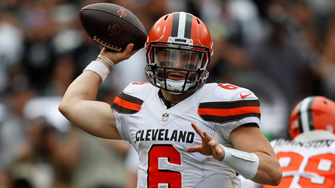 Baker Mayfield passes for first down after a near sack