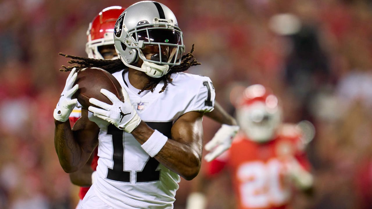 Las Vegas Raiders wide receiver Davante Adams gains first-down yardage ...