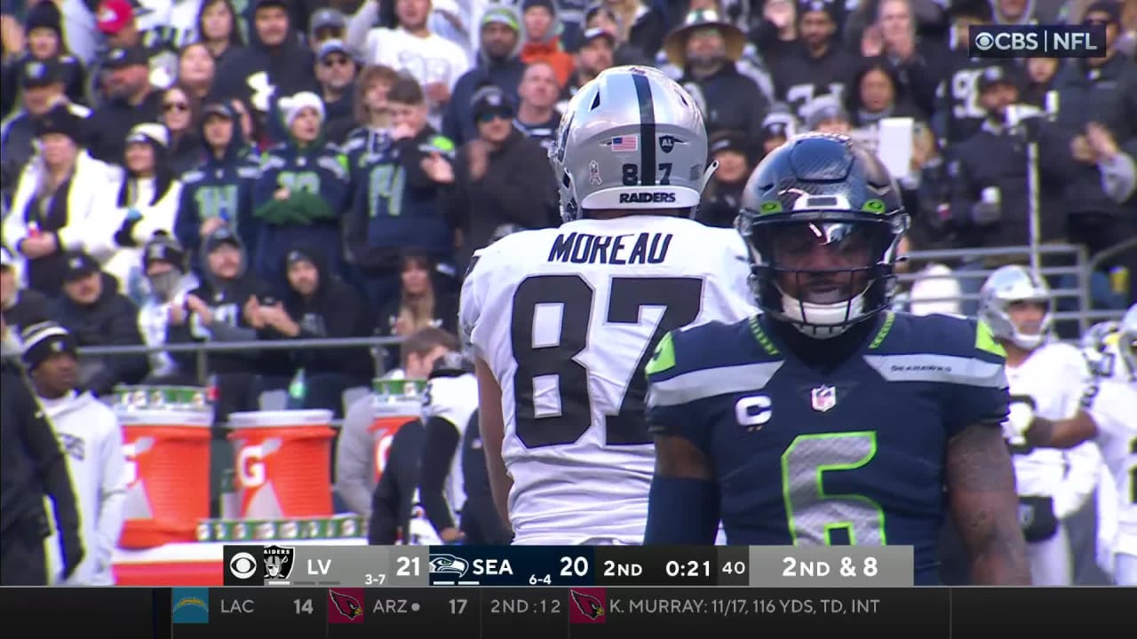 Las Vegas Raiders tight end Foster Moreau takes a seat on the ground to ...