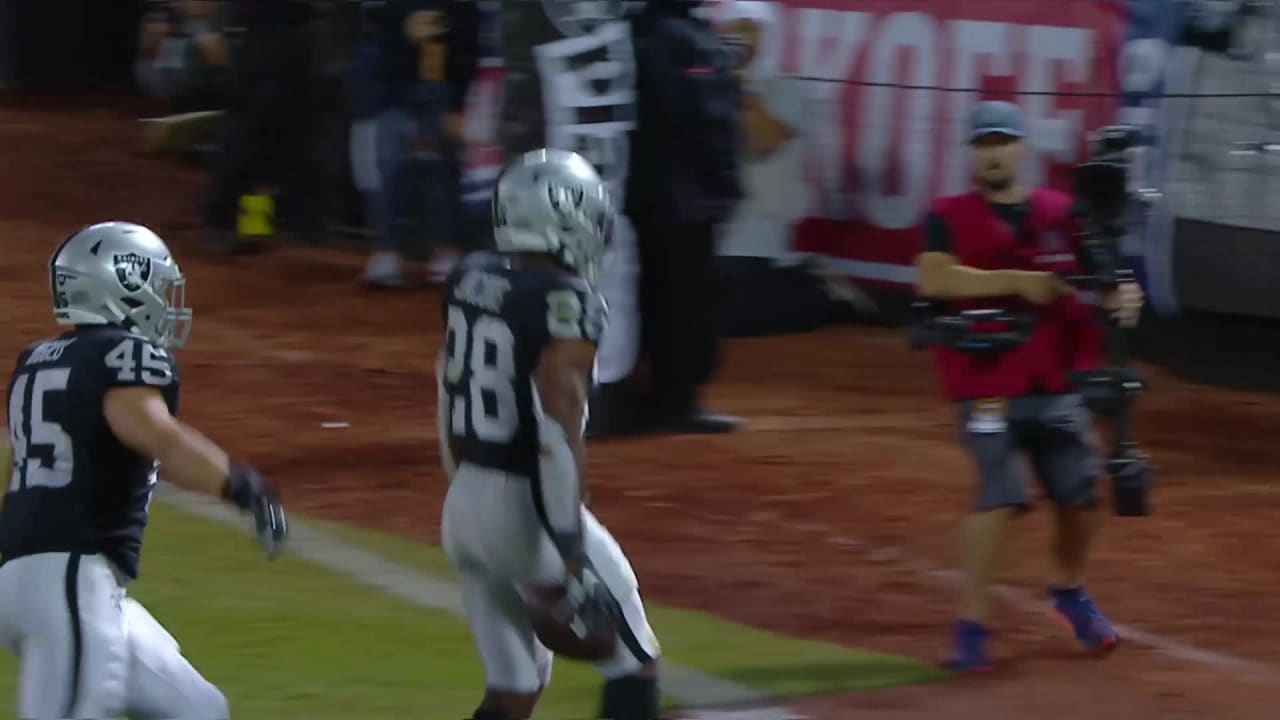 Josh Jacobs bowls over Broncos defenders on his way to second TD run