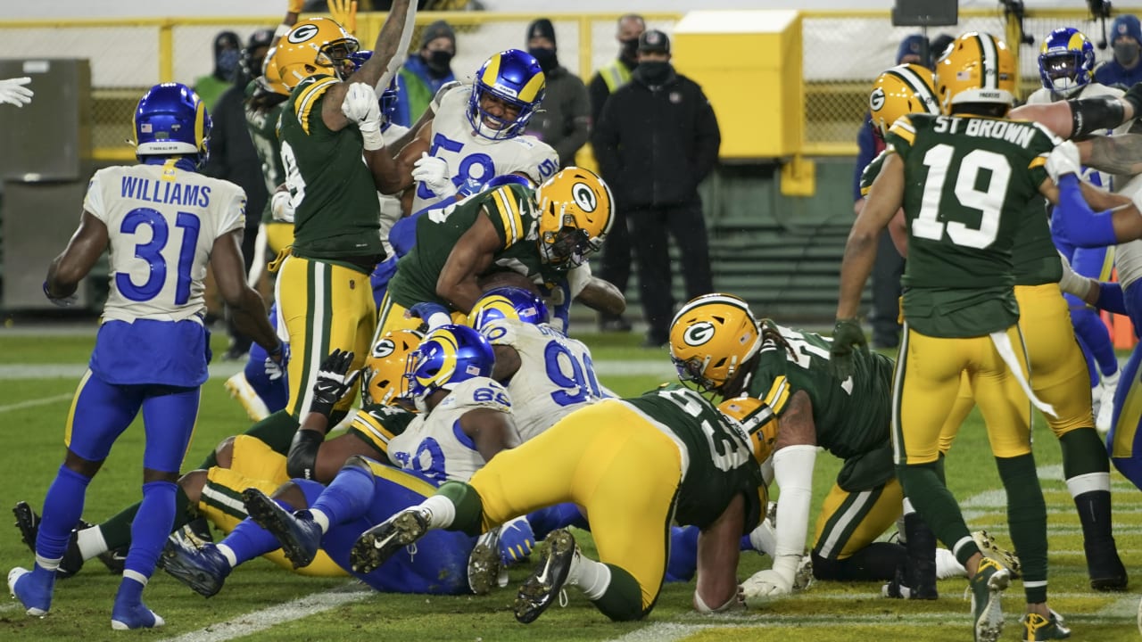 Green Bay Packers running back Aaron Jones backpedals into the end zone ...
