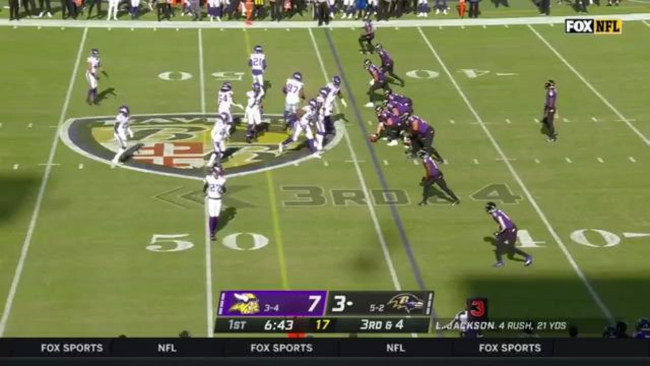 Baltimore Ravens quarterback Lamar Jackson fits running pass into ...