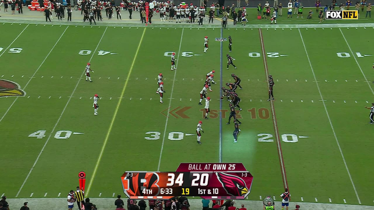 Cincinnati Bengals defensive lineman Trey Hendrickson runs the hoop and ...