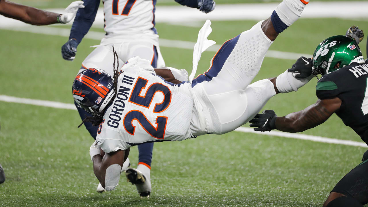 Denver Broncos running back Melvin Gordon goes over goal-line pileup ...