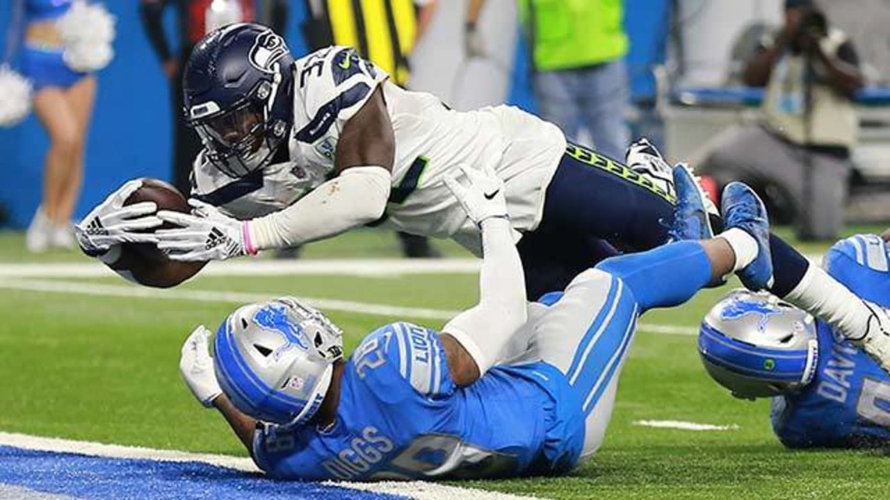 Chris Carson bulldozes through Lions D for TD