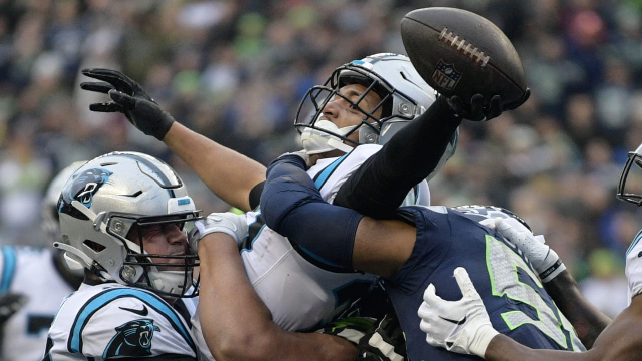 Carolina Panthers running back Chuba Hubbard reaches football up over ...