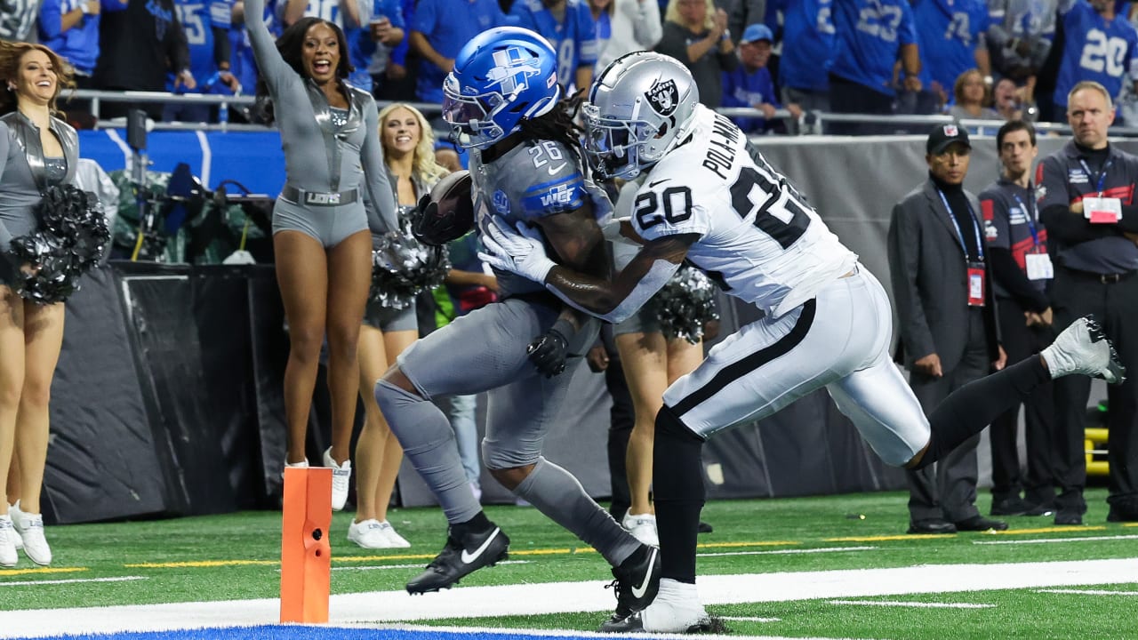 Detroit Lions running back Jahmyr Gibbs climbs into stands to celebrate ...