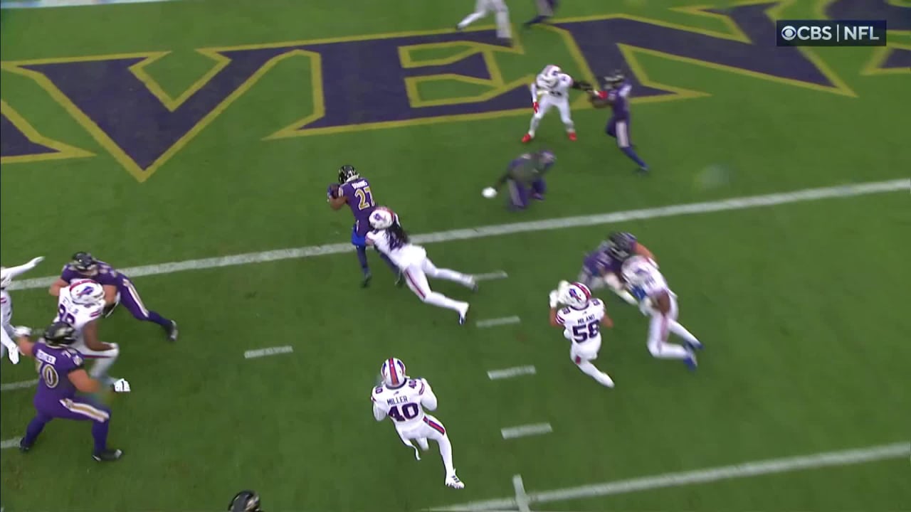Baltimore Ravens running back J.K. Dobbins receives forward pitch from ...