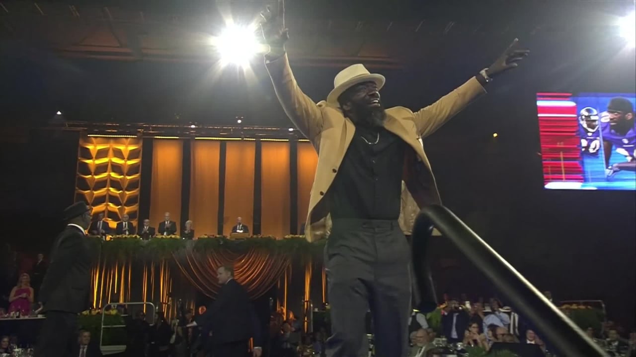 Ed Reed hypes up the crowd after receiving his gold jacket