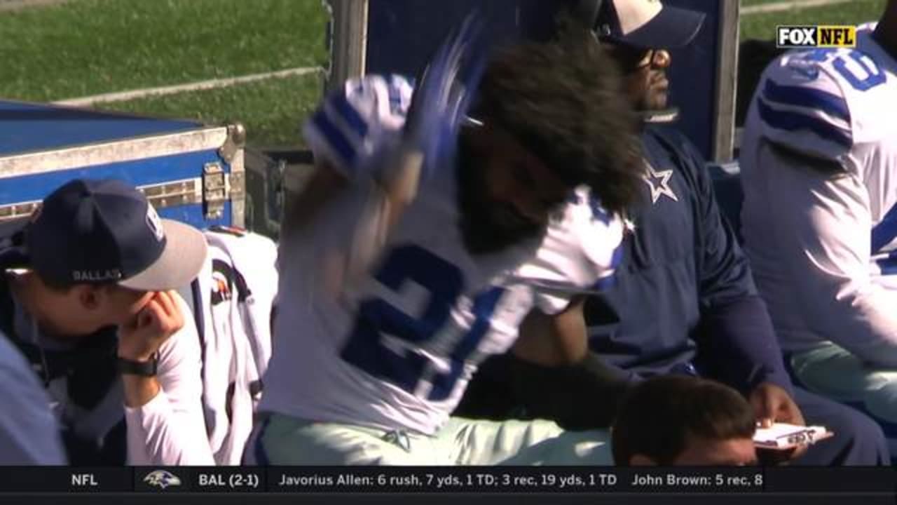 Zeke reacts on sideline after coughing up costly fumble