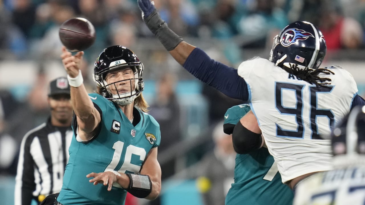 Jacksonville Jaguars quarterback Trevor Lawrence slings a dart to wide receiver Christian Kirk