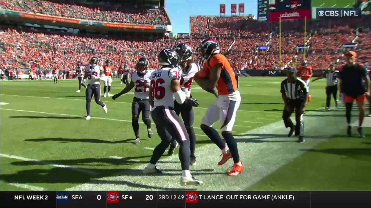 Denver Broncos quarterback Russell Wilson rainbows 34-yard sideline ...