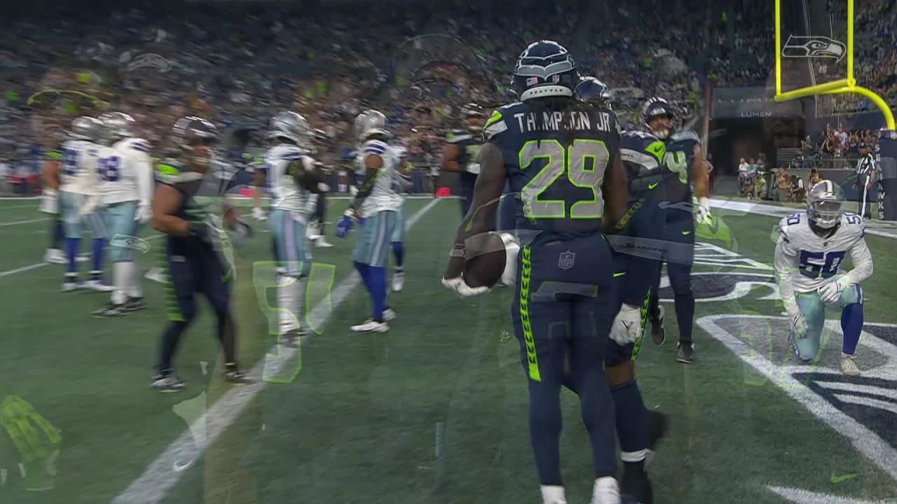 Seattle Seahawks running back SaRodorick Thompson Jr. gets help from ...