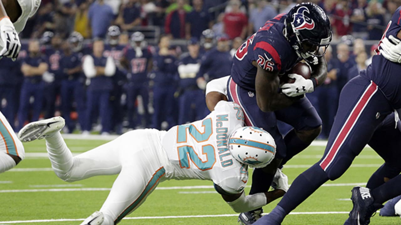 Lamar Miller pushes his way through defenders for TD
