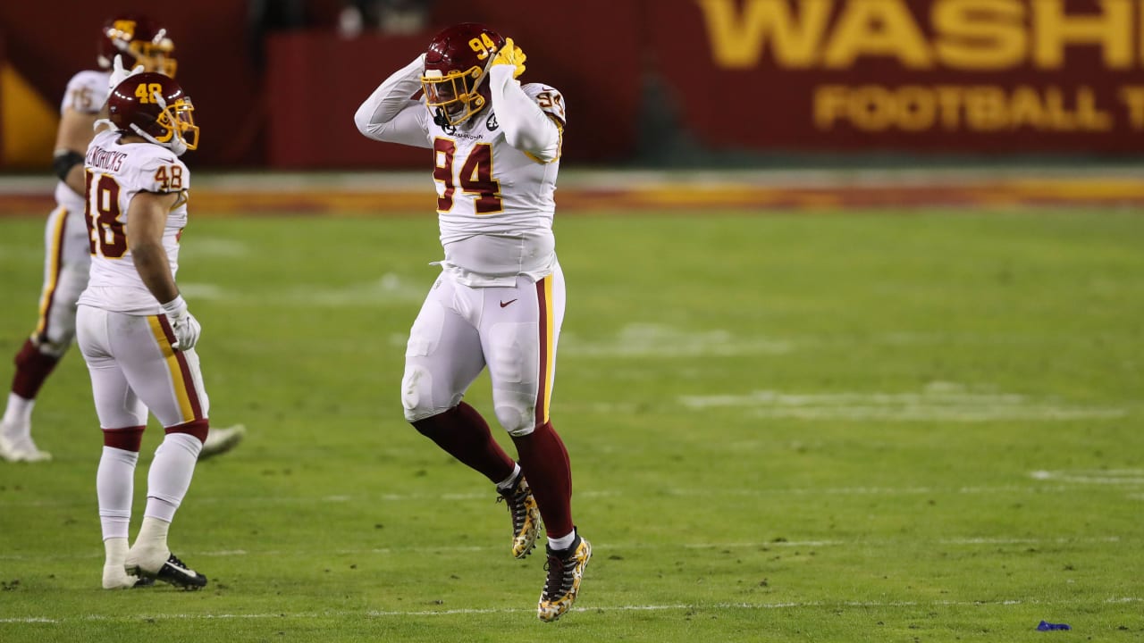 Washington Football Team defensive tackle Daron Payne punches ball from ...