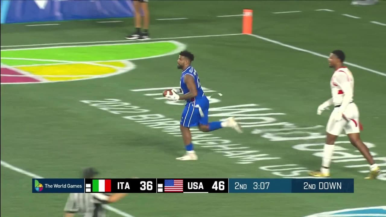 Team Italy flag football player Giuseppe Della Vecchia intercepts Team ...