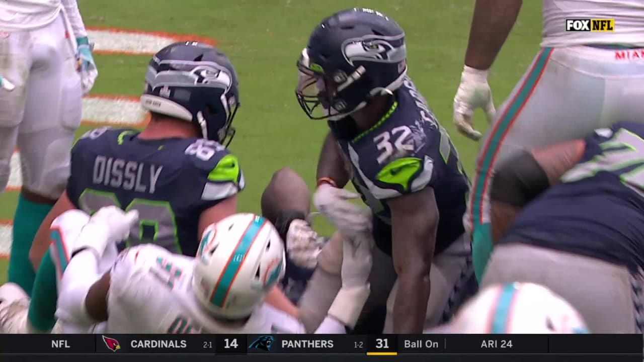 Seattle Seahawks running back Chris Carson plows through the goal-line ...
