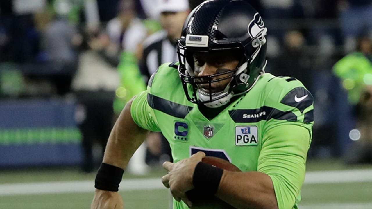 Russell muscles his way to the 1-yard line on QB keeper