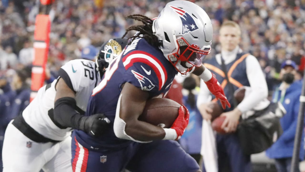 New England Patriots running back Rhamondre Stevenson turns the corner ...