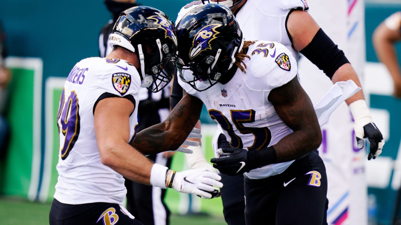 Baltimore Ravens running back Gus Edwards drives through Philadelphia ...