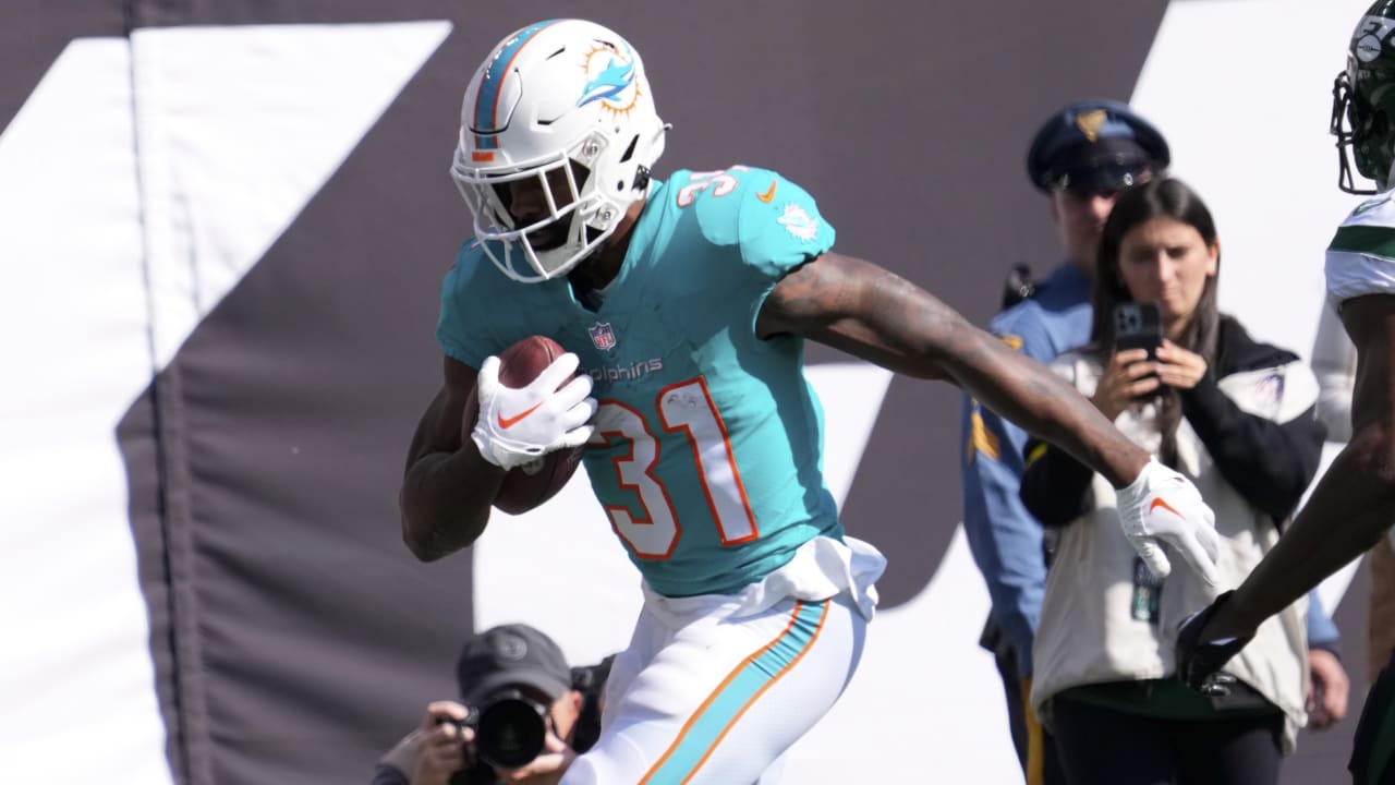 Miami Dolphins running back Raheem Mostert breaks free from Mosley's ...