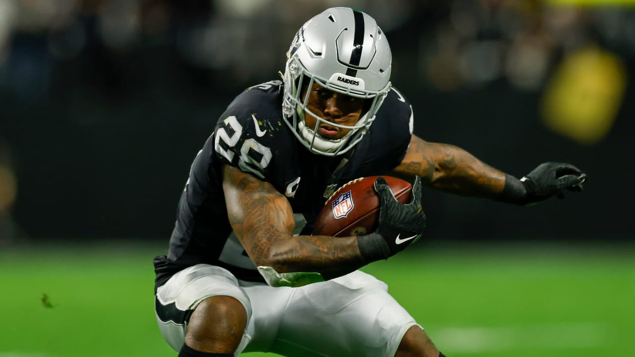 Las Vegas Raiders running back Josh Jacobs lowers his shoulder for a ...