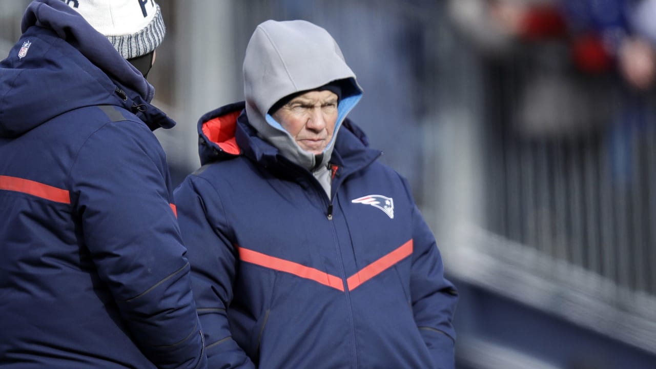 Bill Belichick takes on the cold in shorts, cut-off hoodie