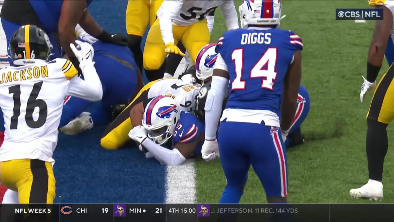 Buffalo Bills tight end Quintin Morris coughs up the football prior to ...