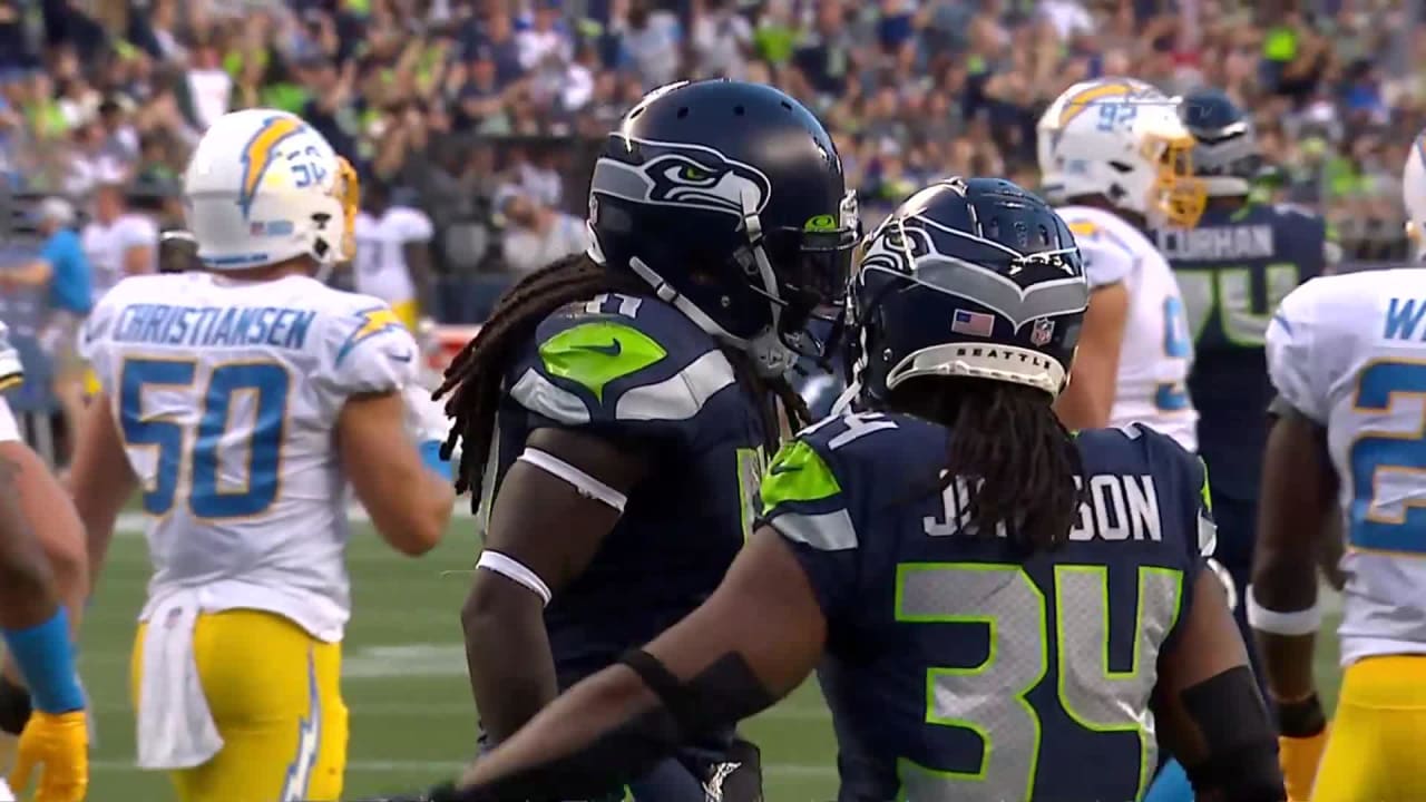 Seattle Seahawks running back Alex Collins slices through the Los ...