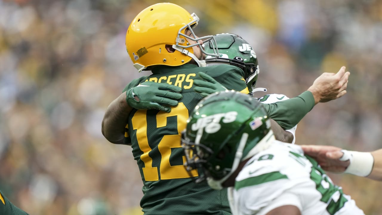 Football slips out of Green Bay Packers quarterback Aaron Rodgers ...