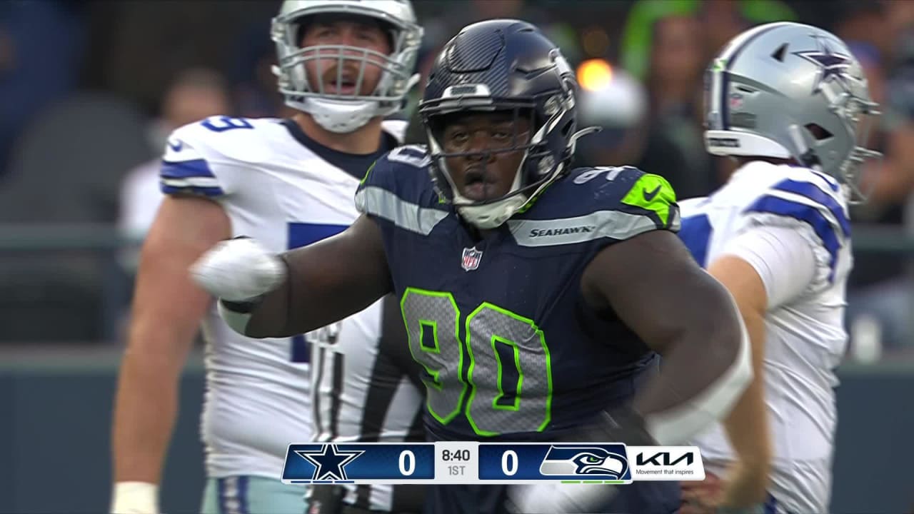 Defensive tackle Jarran Reed swings down Dallas Cowboys quarterback ...